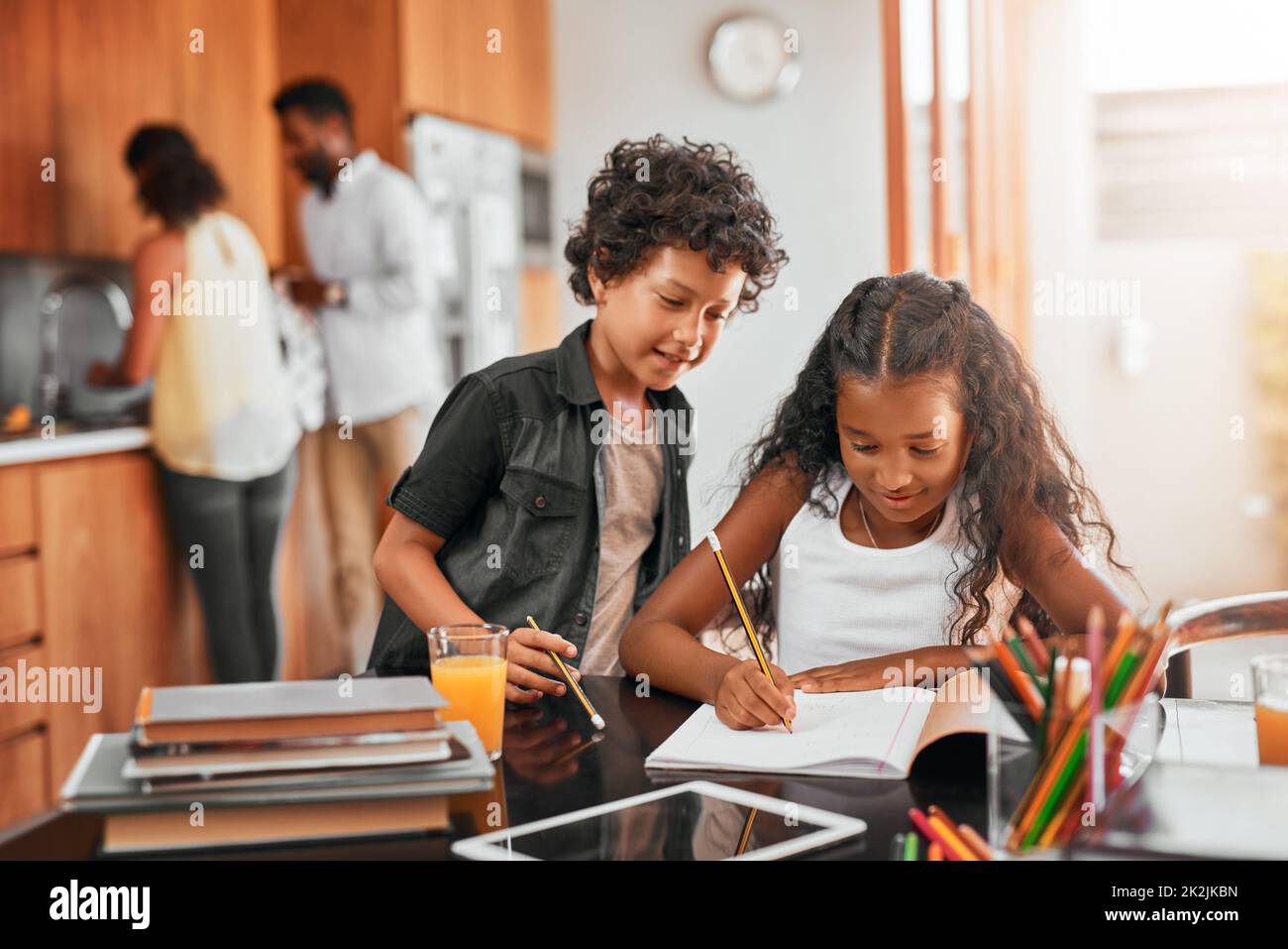 Girl helping boy homework desk hi-res stock photography and images - Alamy