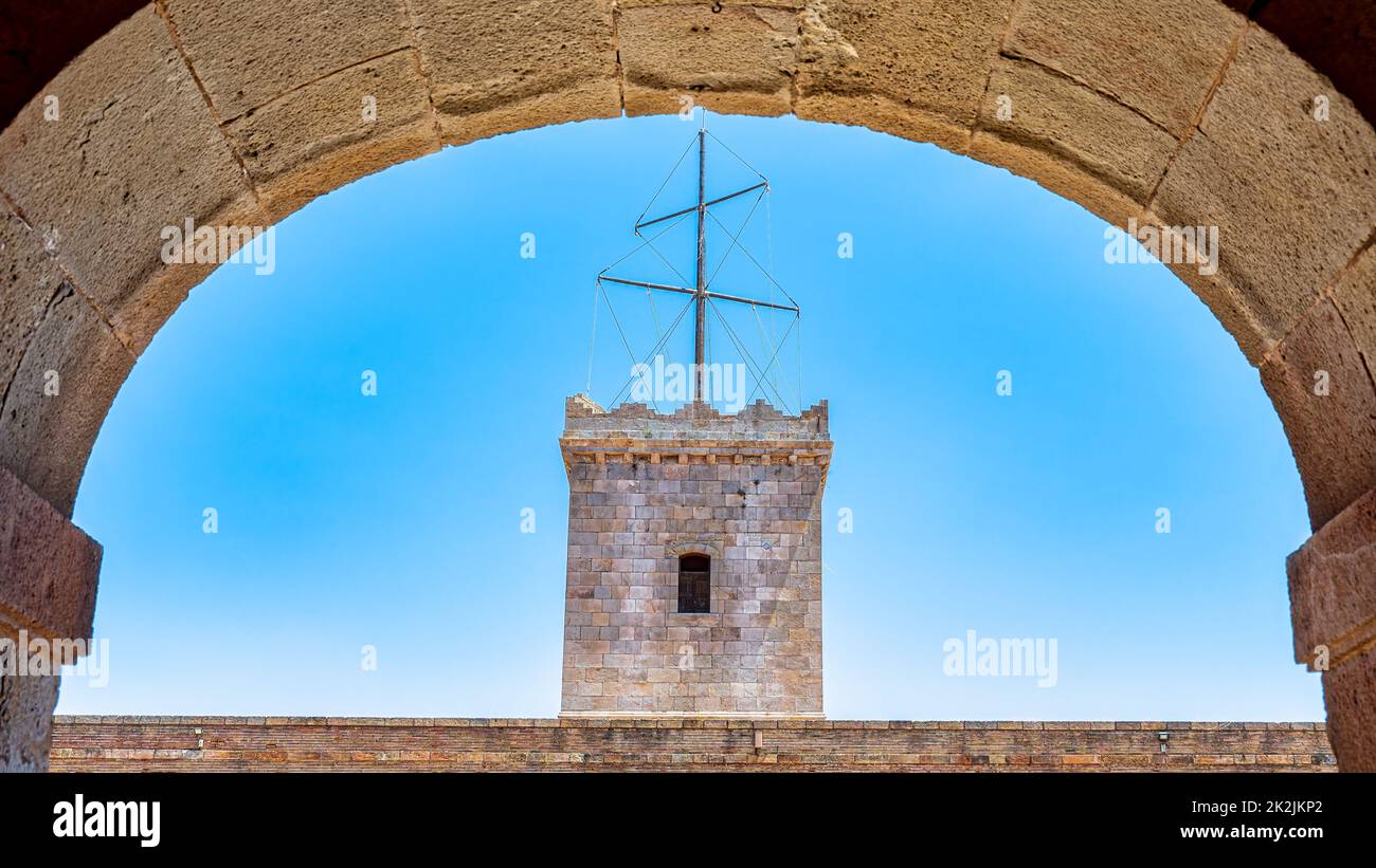 Montjuic Castle or Fort. A tower is framed in an arched door Stock ...