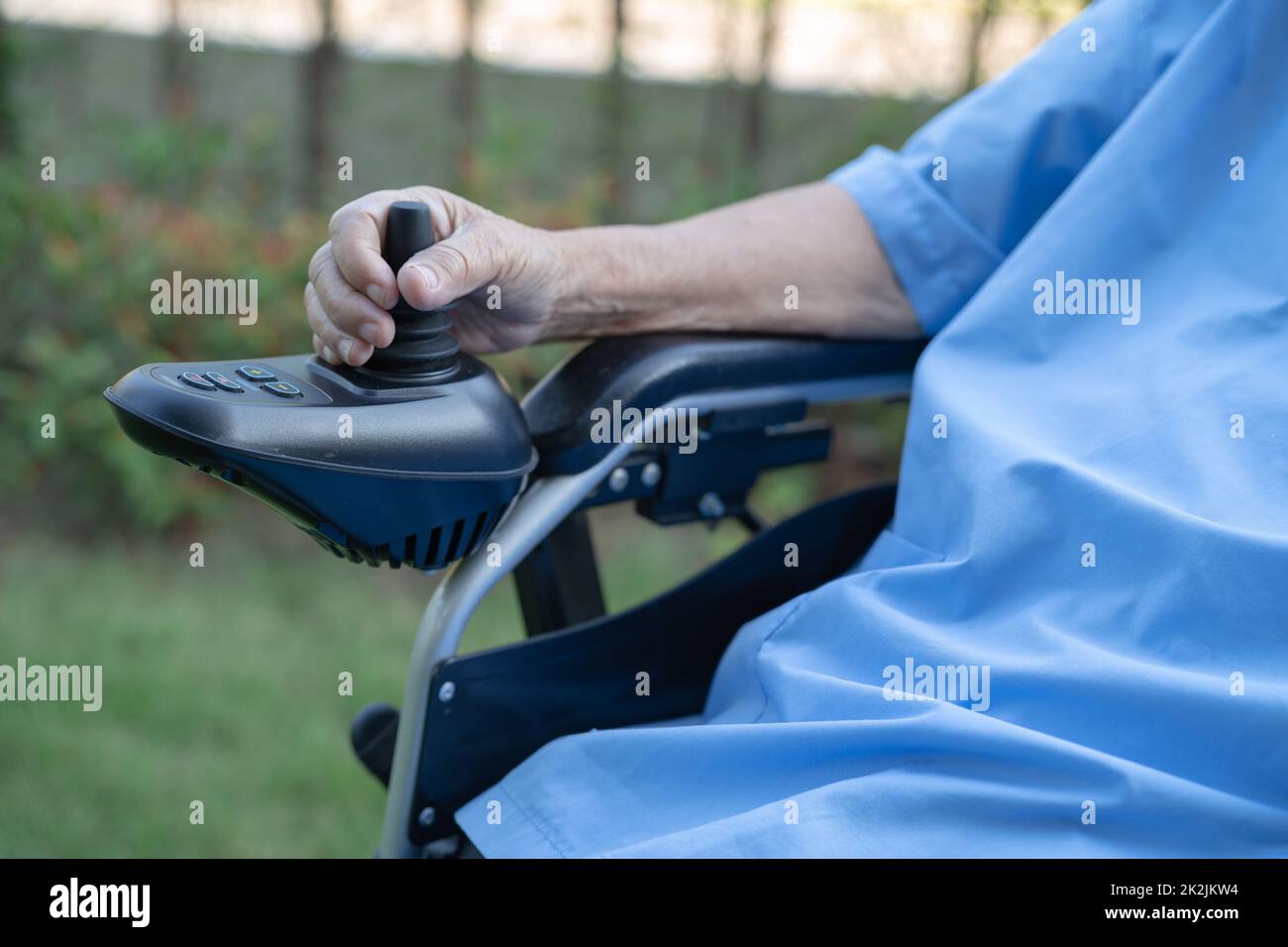 Asian senior or elderly old lady woman patient on electric wheelchair ...