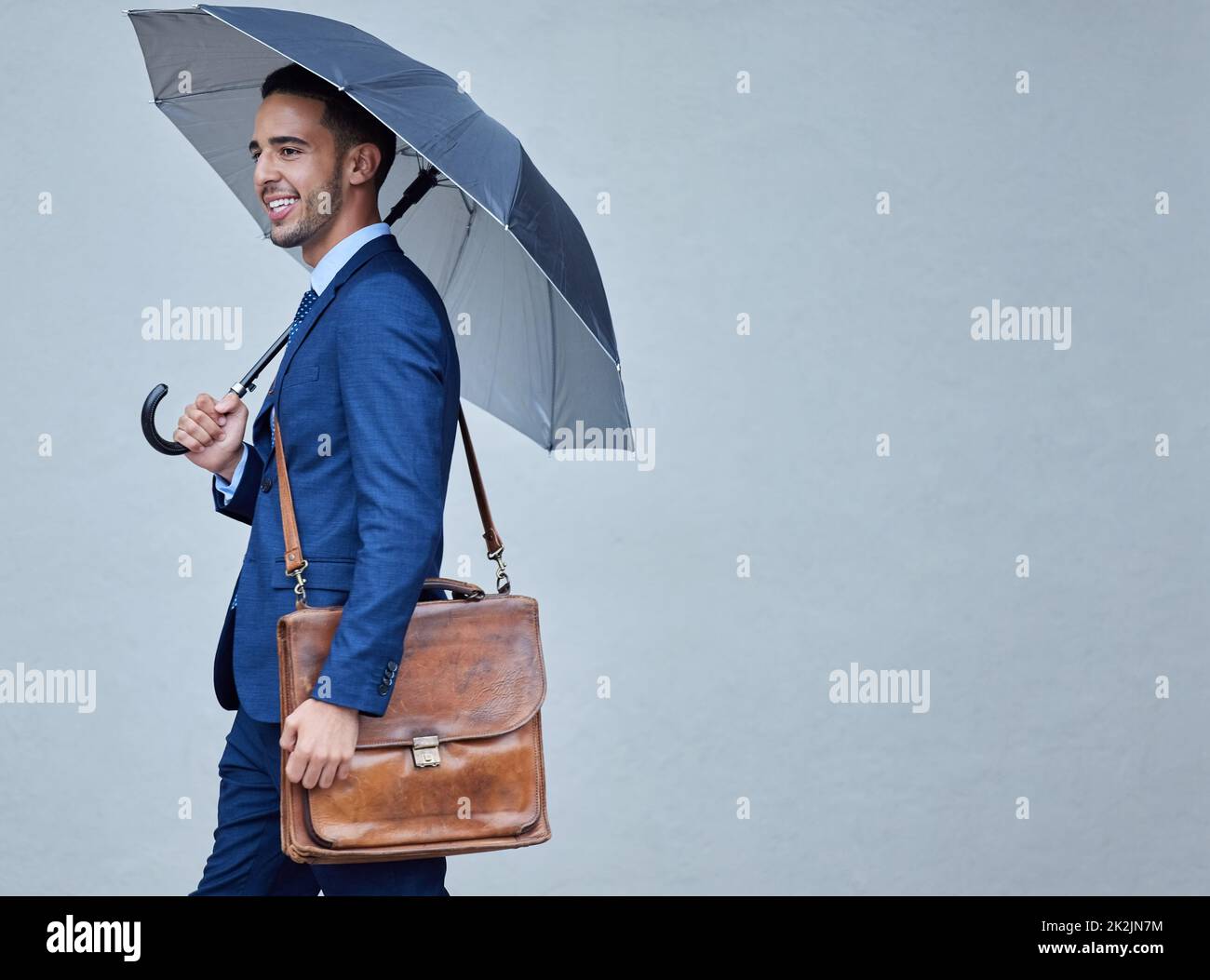 Man walking with satchel hi-res stock photography and images - Alamy