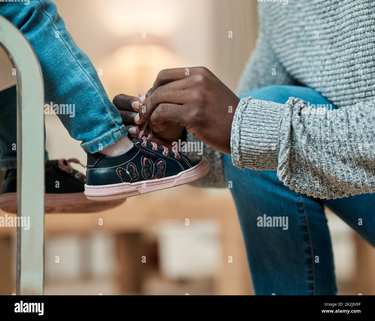 Helping child tie shoes hi-res stock photography and images - Alamy