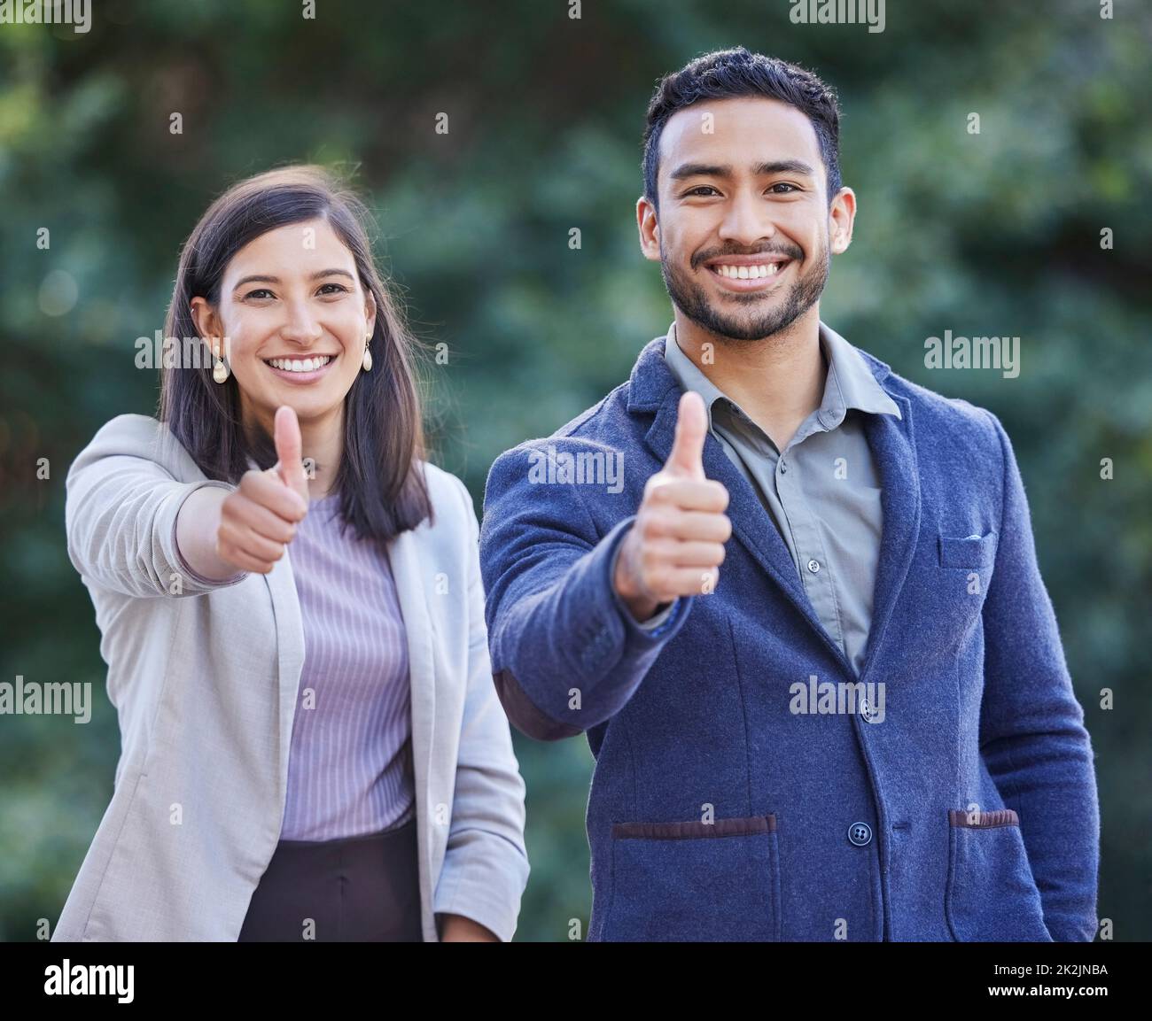 Youll always win with us. Shot of two businesspeople giving the thumbs ...