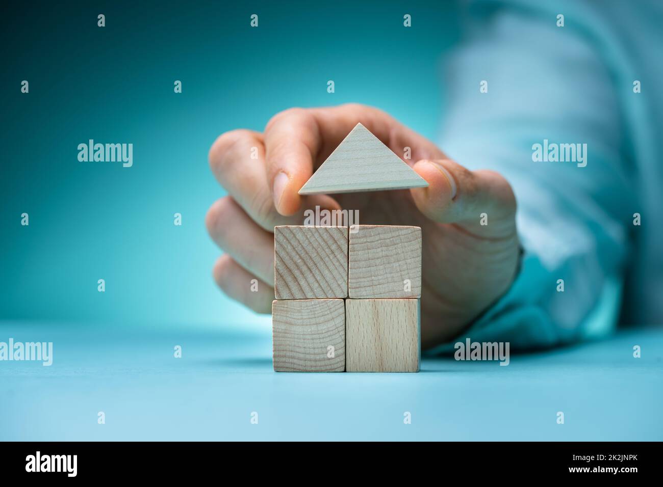 Man's Hand Holding A Roof Stock Photo - Alamy