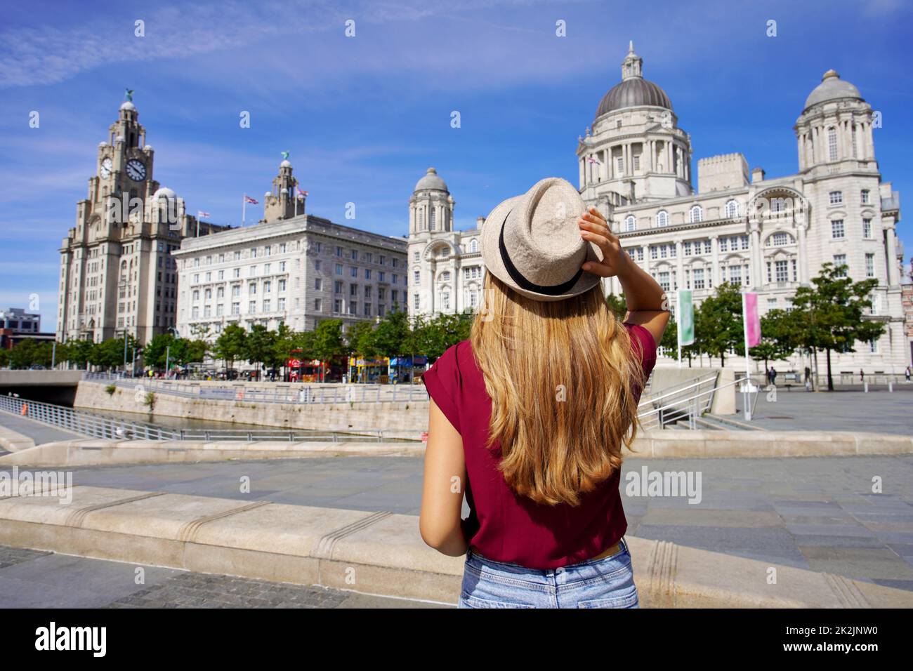 Holidays in Liverpool, UK. Beautiful young woman visiting Pier Head ...