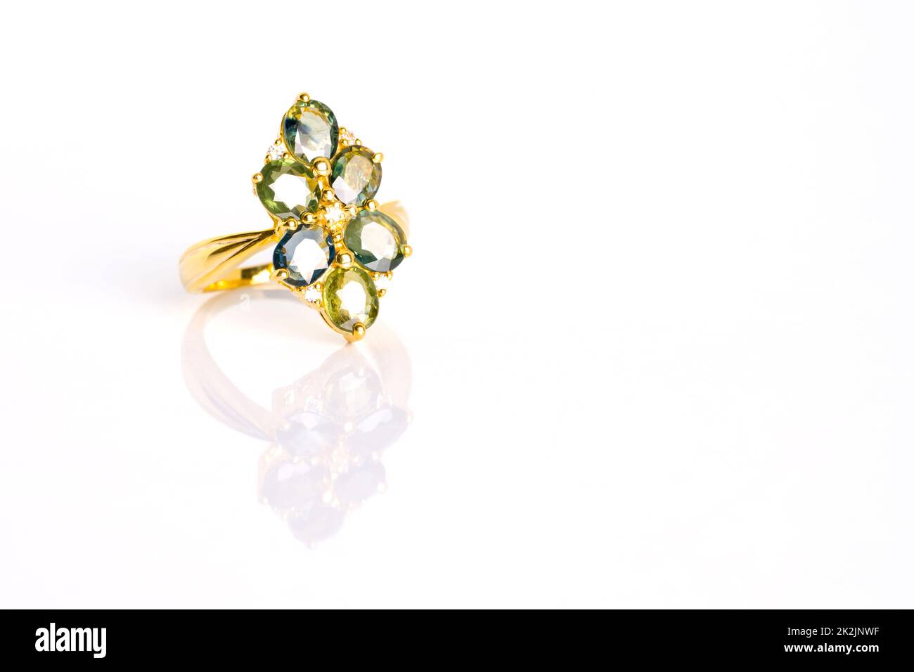 Green Sapphire and Diamond Jewel or gems ring on white background with ...