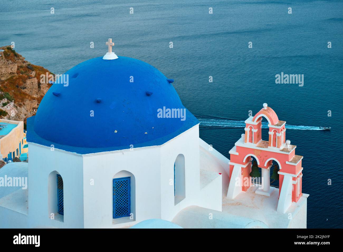 Famous view from viewpoint of Santorini Oia village with blue dome of ...