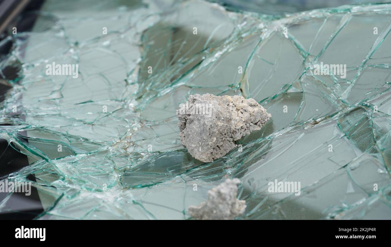 Ð’roken car windshield with a stone on it. Shattered window surface ...