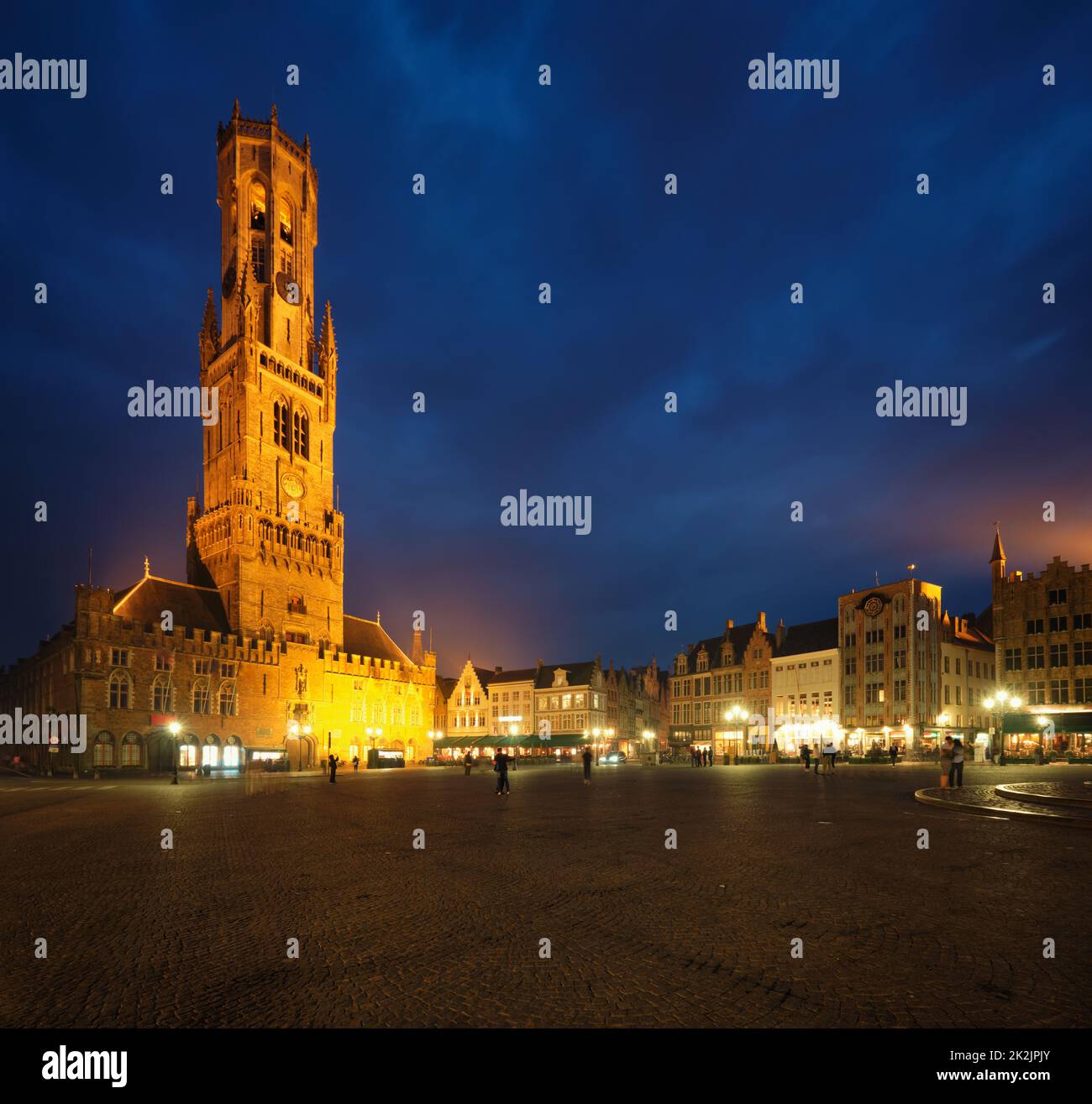 Belfry tower and Grote markt square in Bruges, Belgium on dusk in ...
