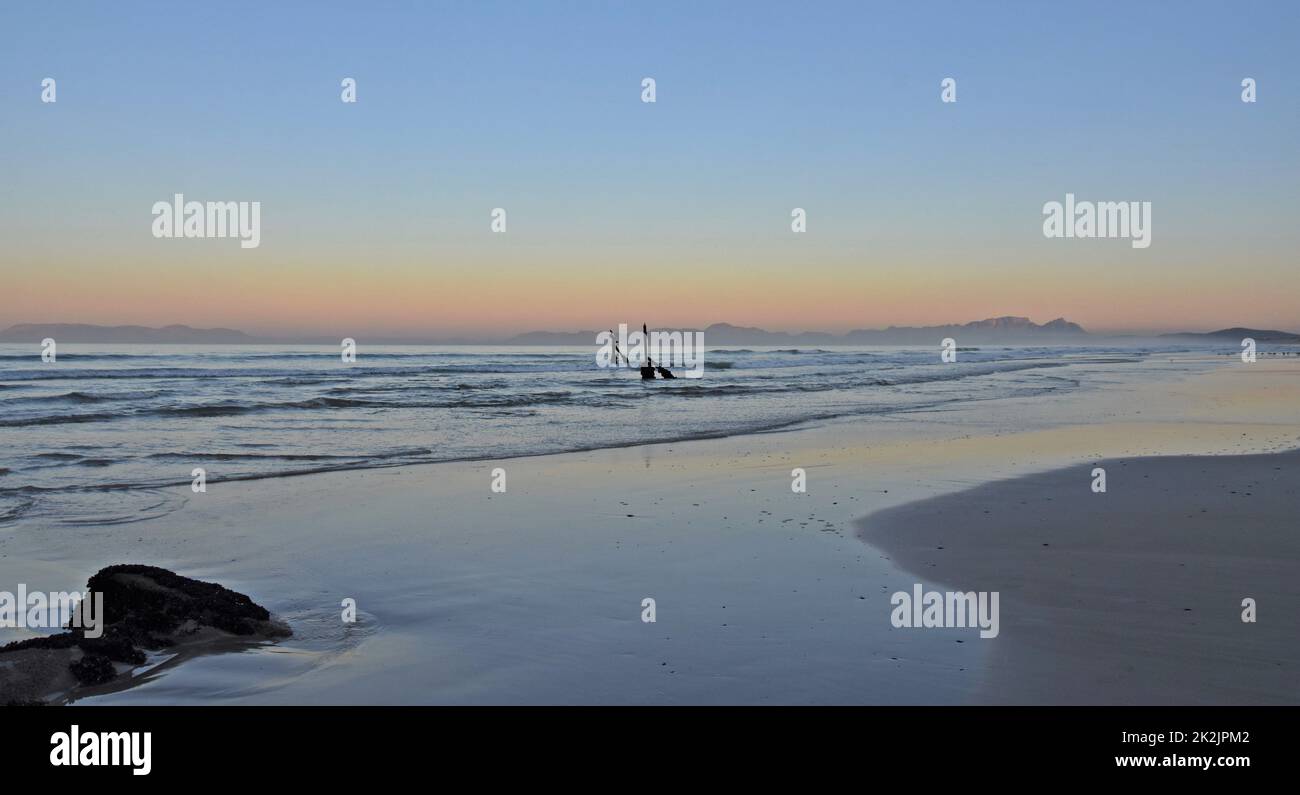 Landscape a beautiful sunrise over the beach in Strand and the False ...
