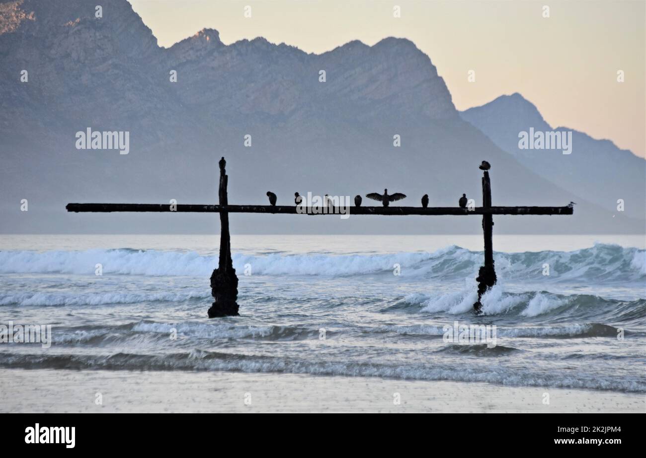 Landscape with a beautiful sunrise over the beach in Strand and the ...