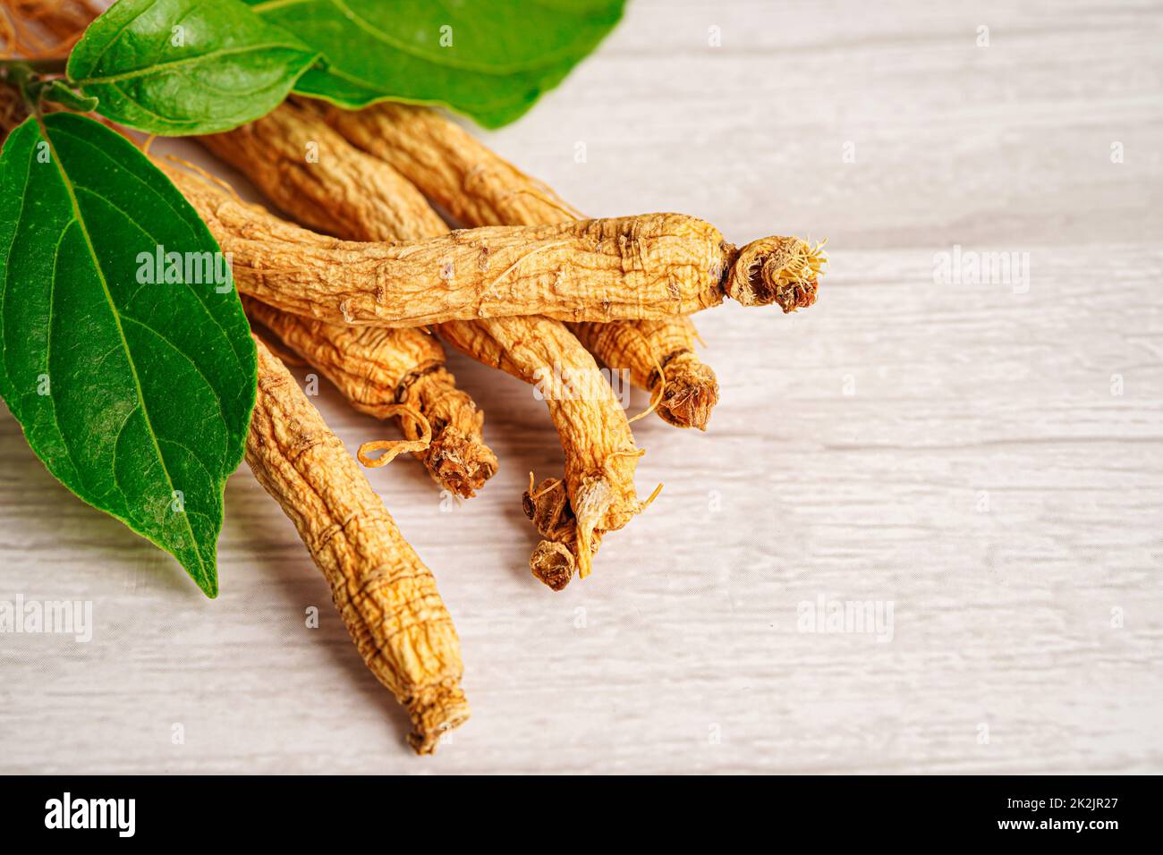 Ginseng roots and green leaf, healthy food Stock Photo - Alamy