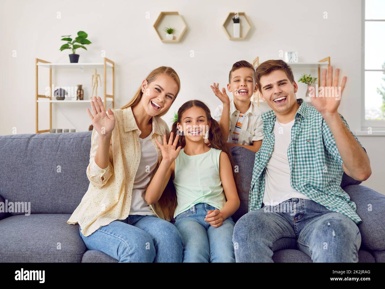Children waving hello hi-res stock photography and images - Alamy