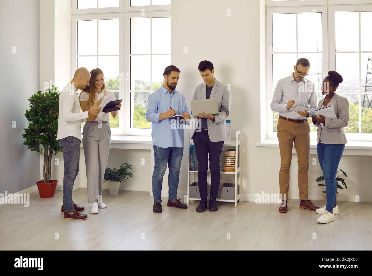 Group of multiracial business professionals working in a modern office ...