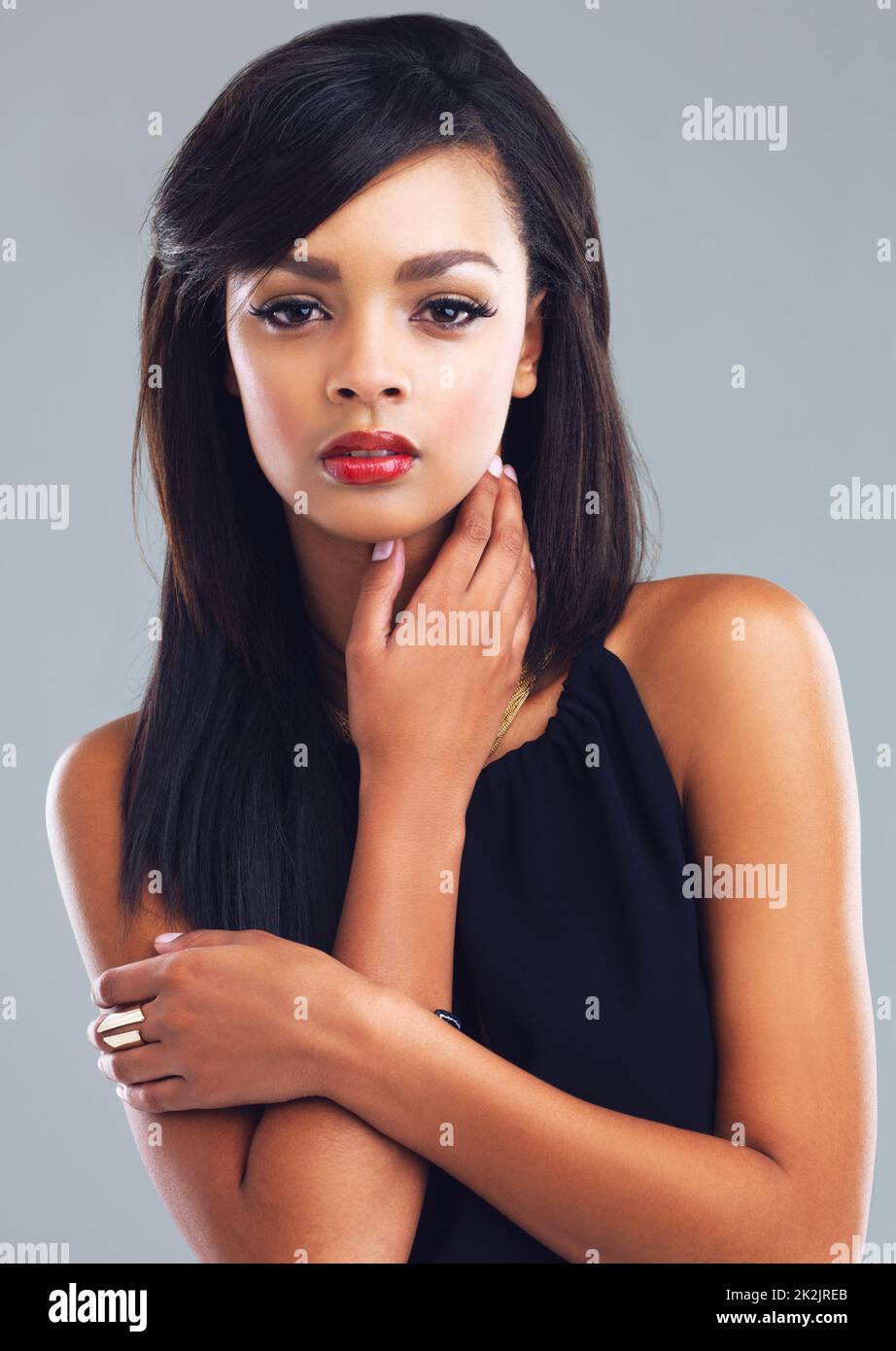 Simple is beautiful. Portrait of a beautiful young woman posing against ...