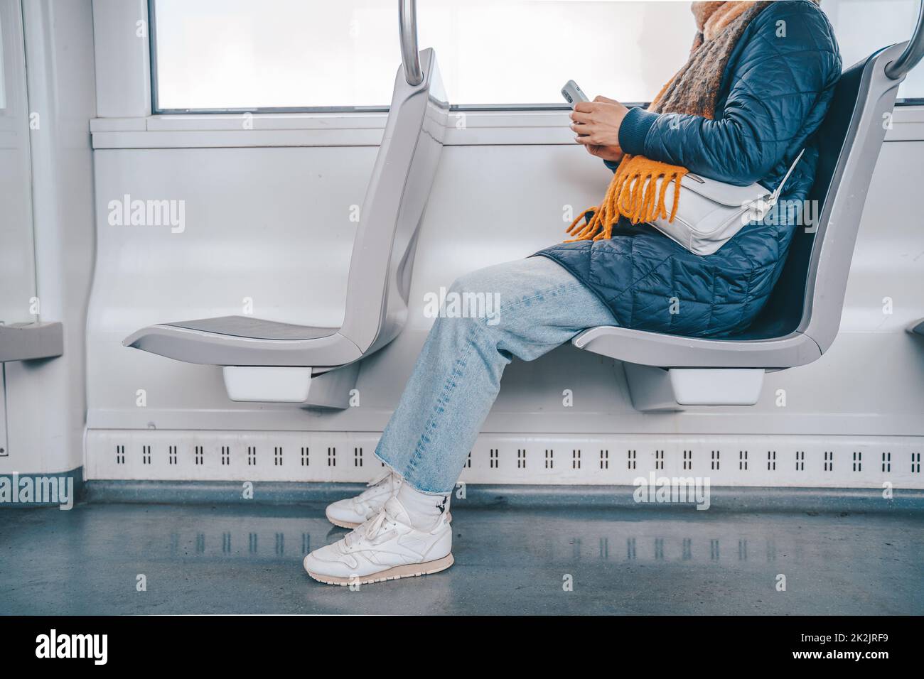 Senior woman send message with a mobile phone in a train Stock Photo ...