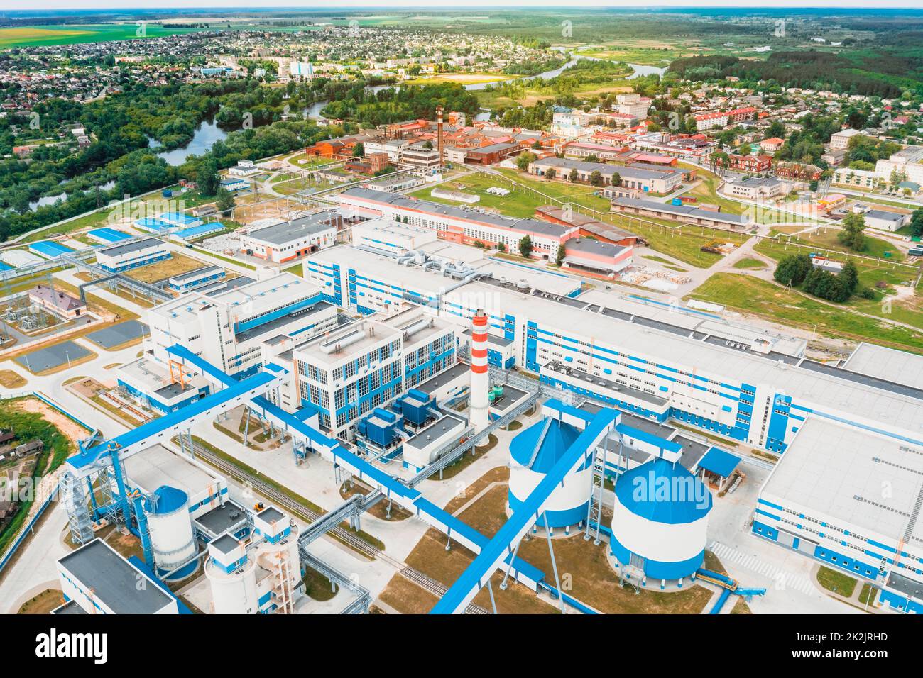 Aerial view of modern paper mill and old paper factory in summer sunny ...