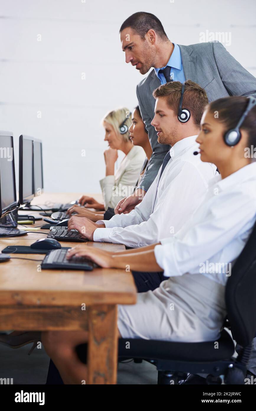 Training them to be effective. a people working in a call center Stock ...