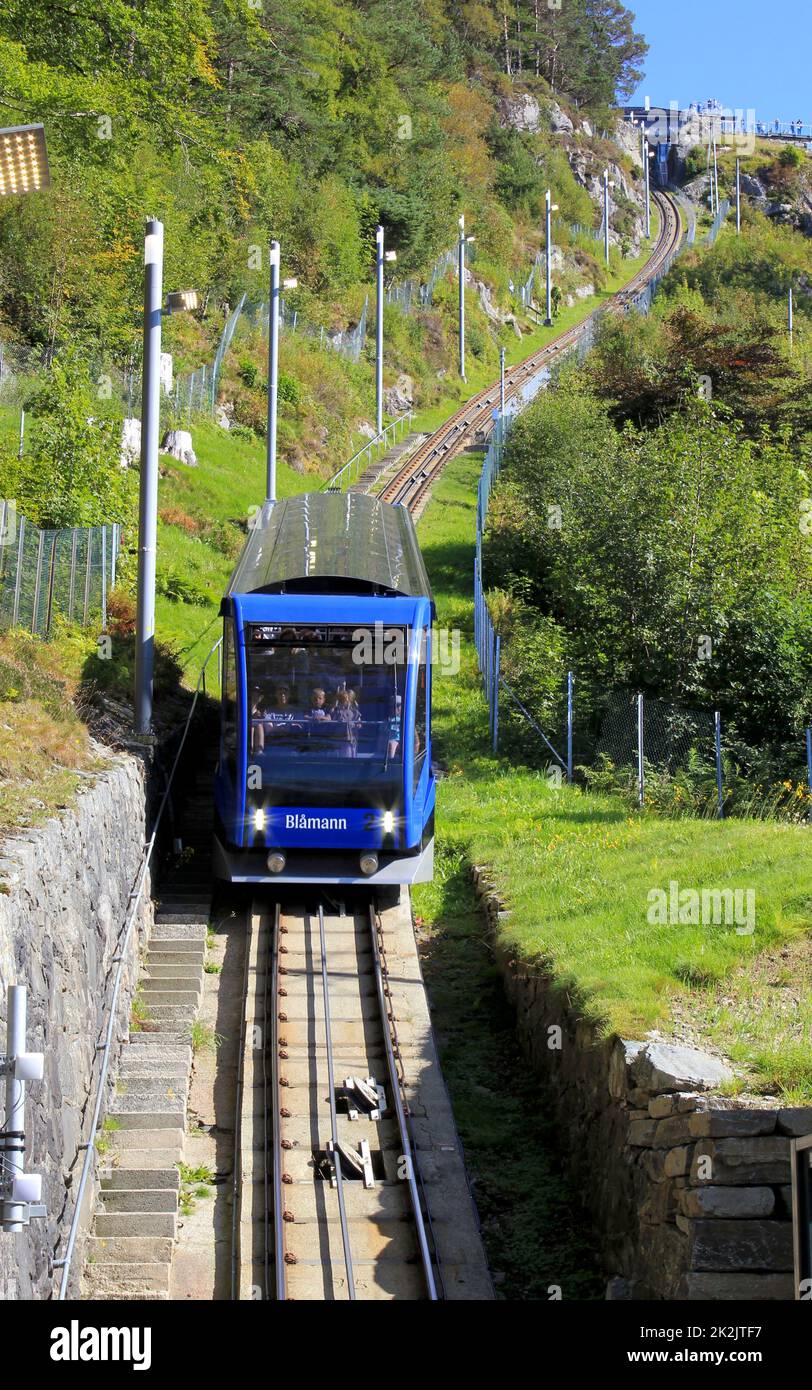 The Floibanen Funicular descends the tracks towards Bergen in Norway ...