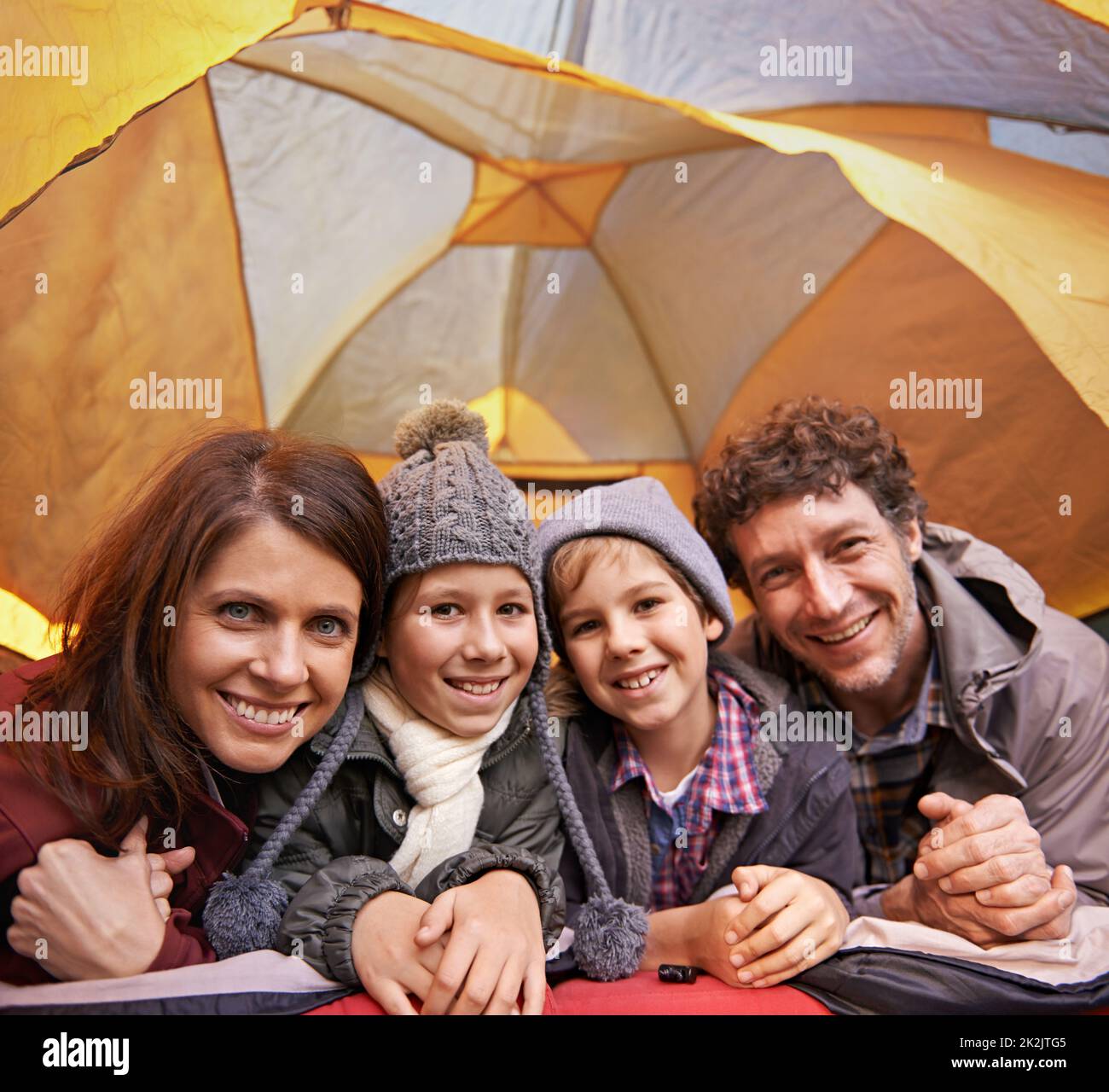 Family camping is family bonding. Portrait of smiling family of four ...