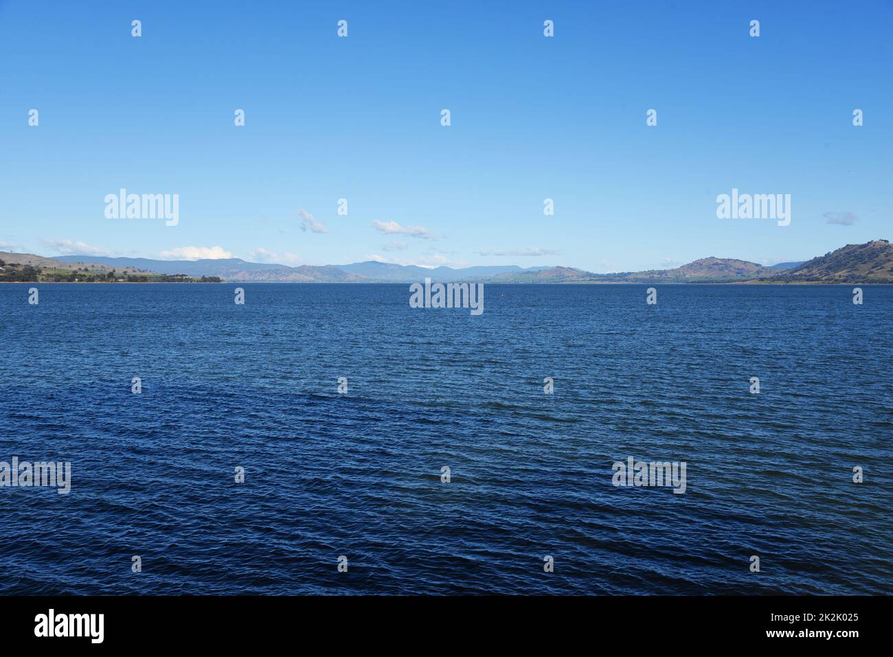 The blue sky with dark blue river of the Murray River, is a river in ...