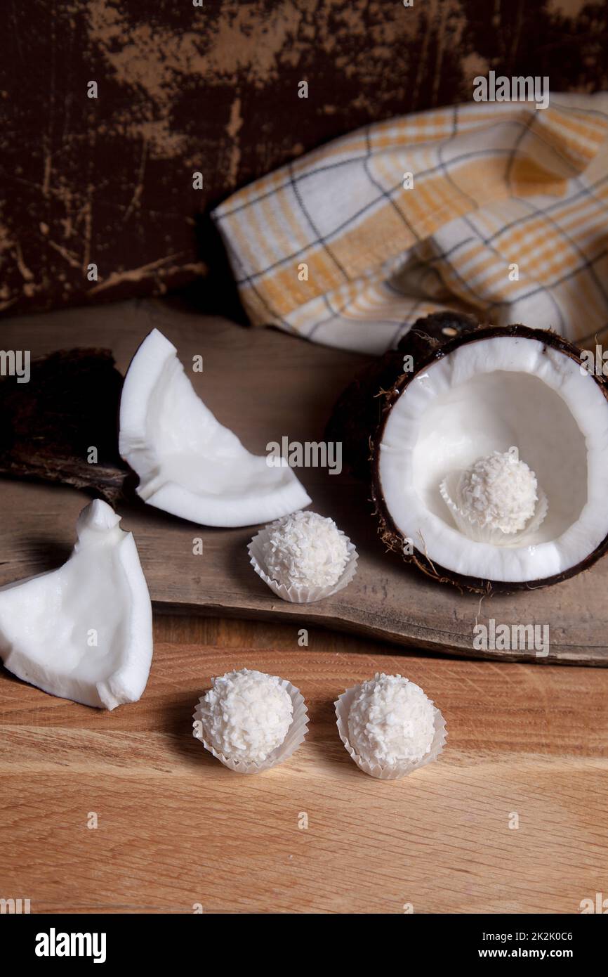 Coconut and sweet chocolate coconut truffles. Coconut shell, coconut ...