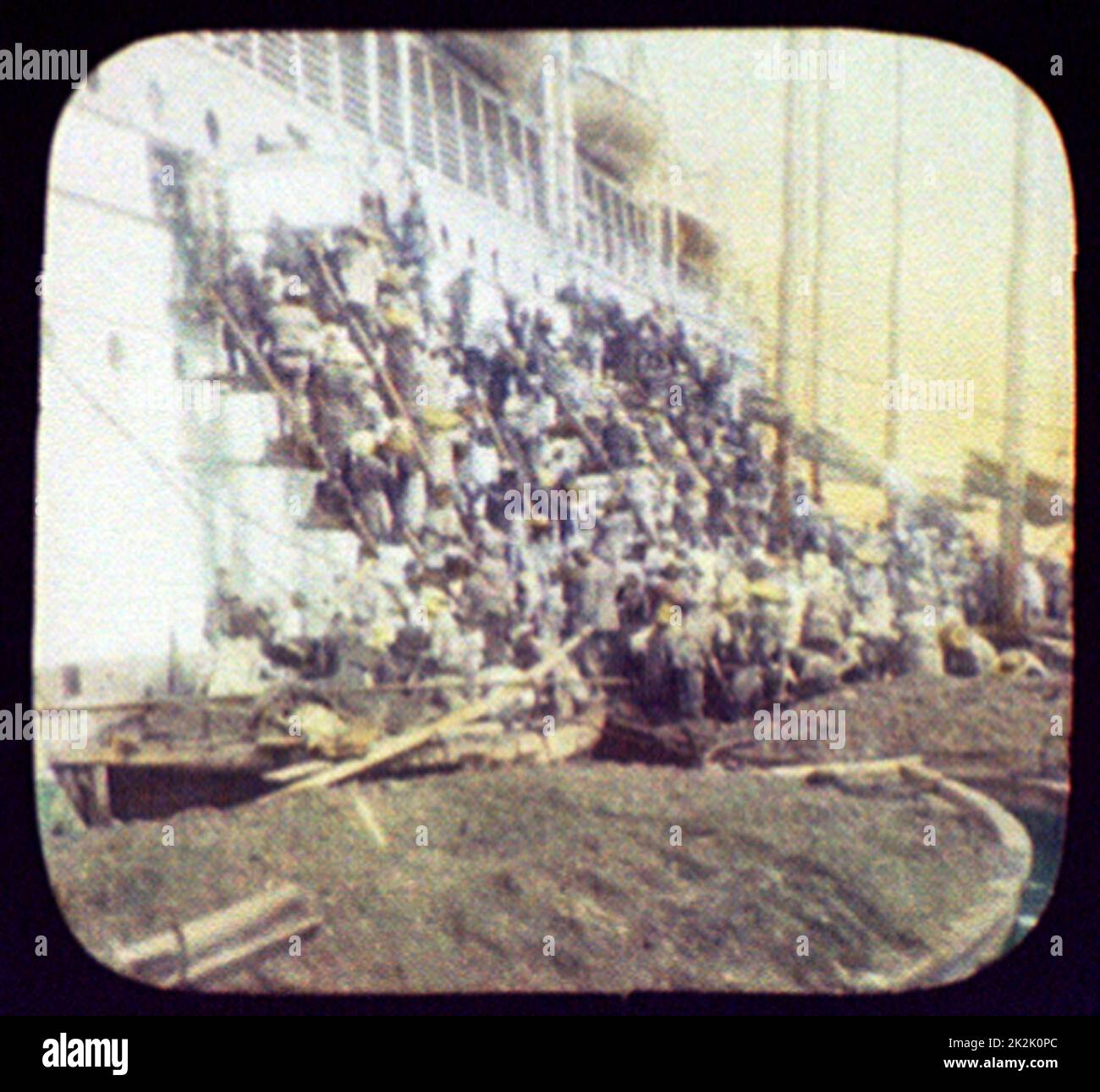 Workers coaling a ship: Nagasaki, Japan, 1895. Hand-coloured lantern ...