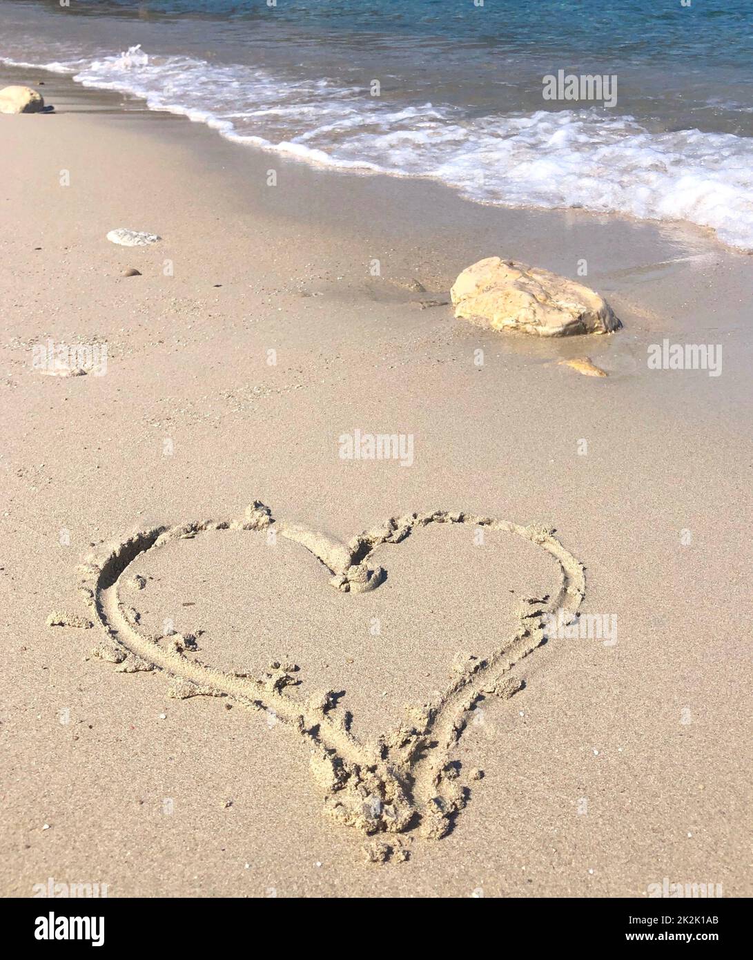 Heart in the sand Stock Photo - Alamy