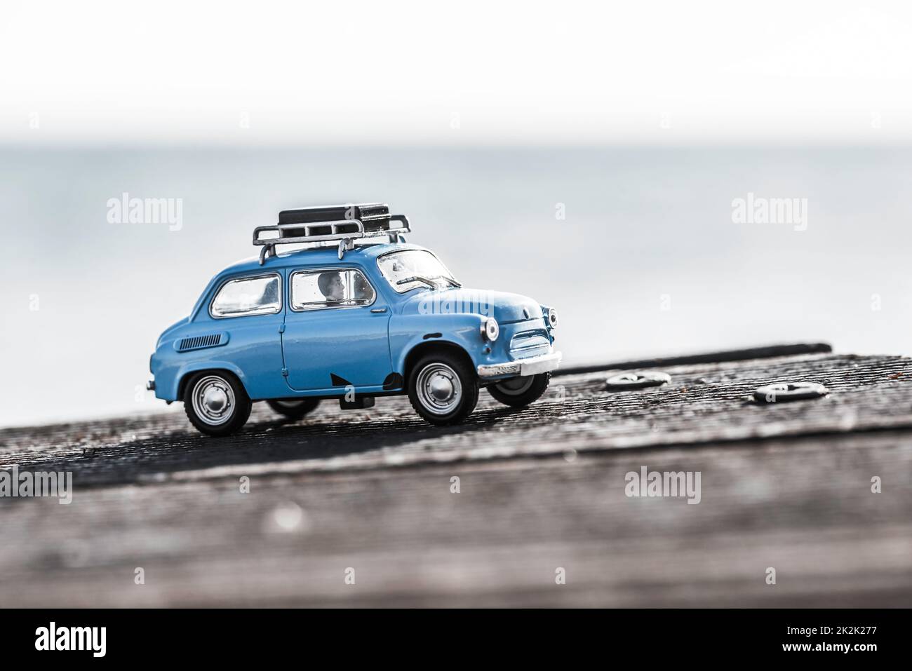 Cute blue retro travel car with luggage. Macro photo Stock Photo - Alamy