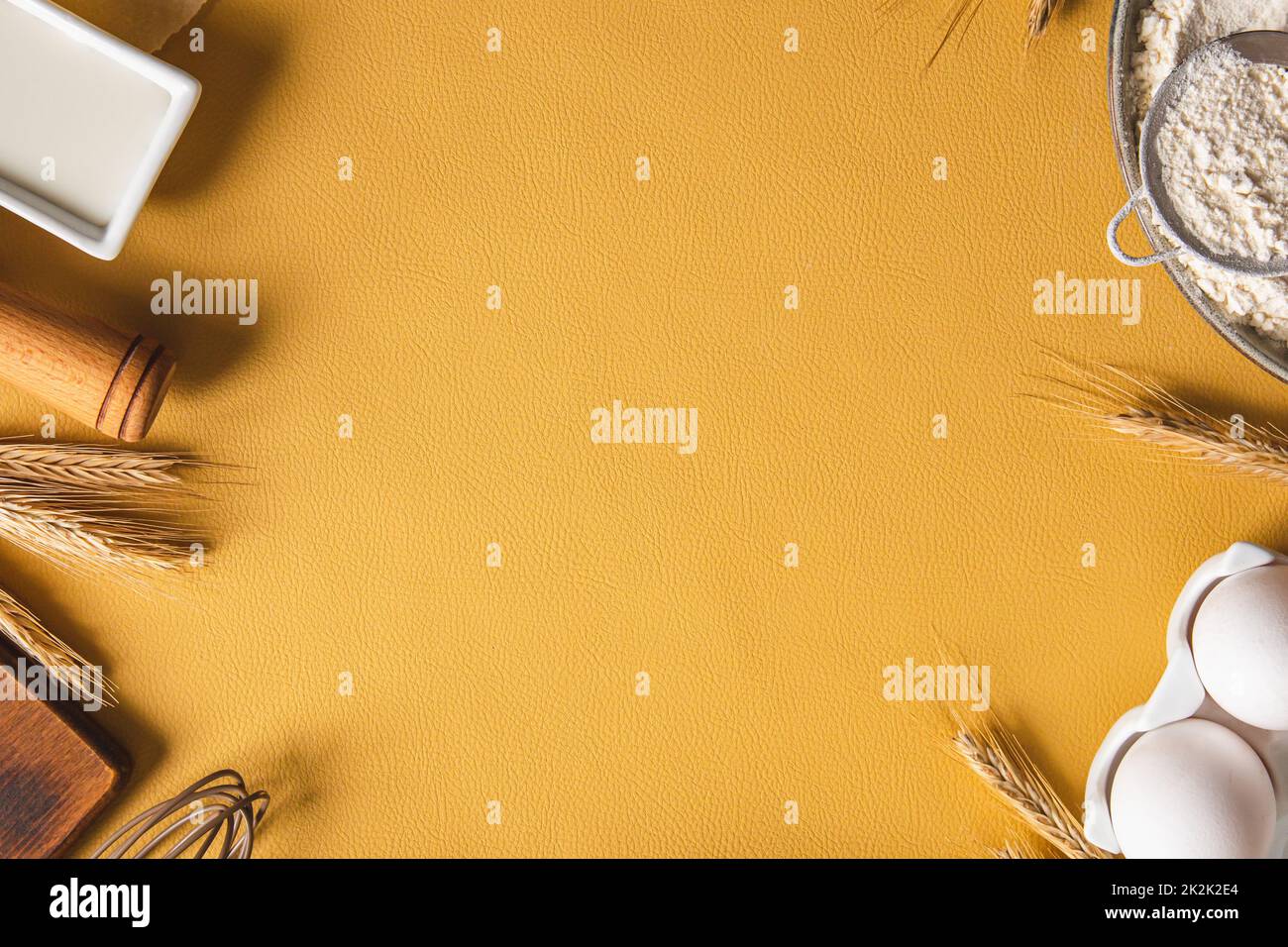 Frame of food ingredients for baking on a yellow background. Cooking ...