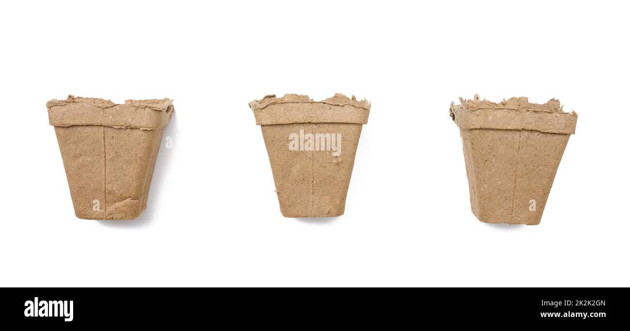 Empty paper pots for planting seed on white isolated background, set ...