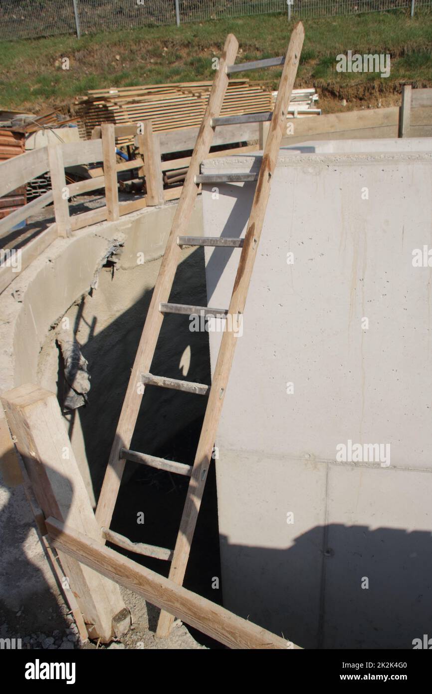Ladder into pit hi-res stock photography and images - Alamy