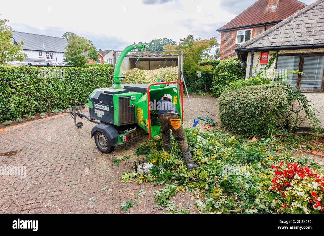 Loading a commercial GreenMech Quadchip 160 woodchipper in operation in ...