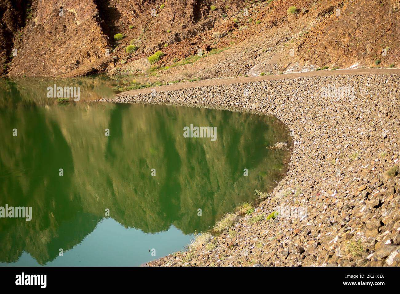 Scenic Hatta dam lake with characteristic mountain range landscape in ...