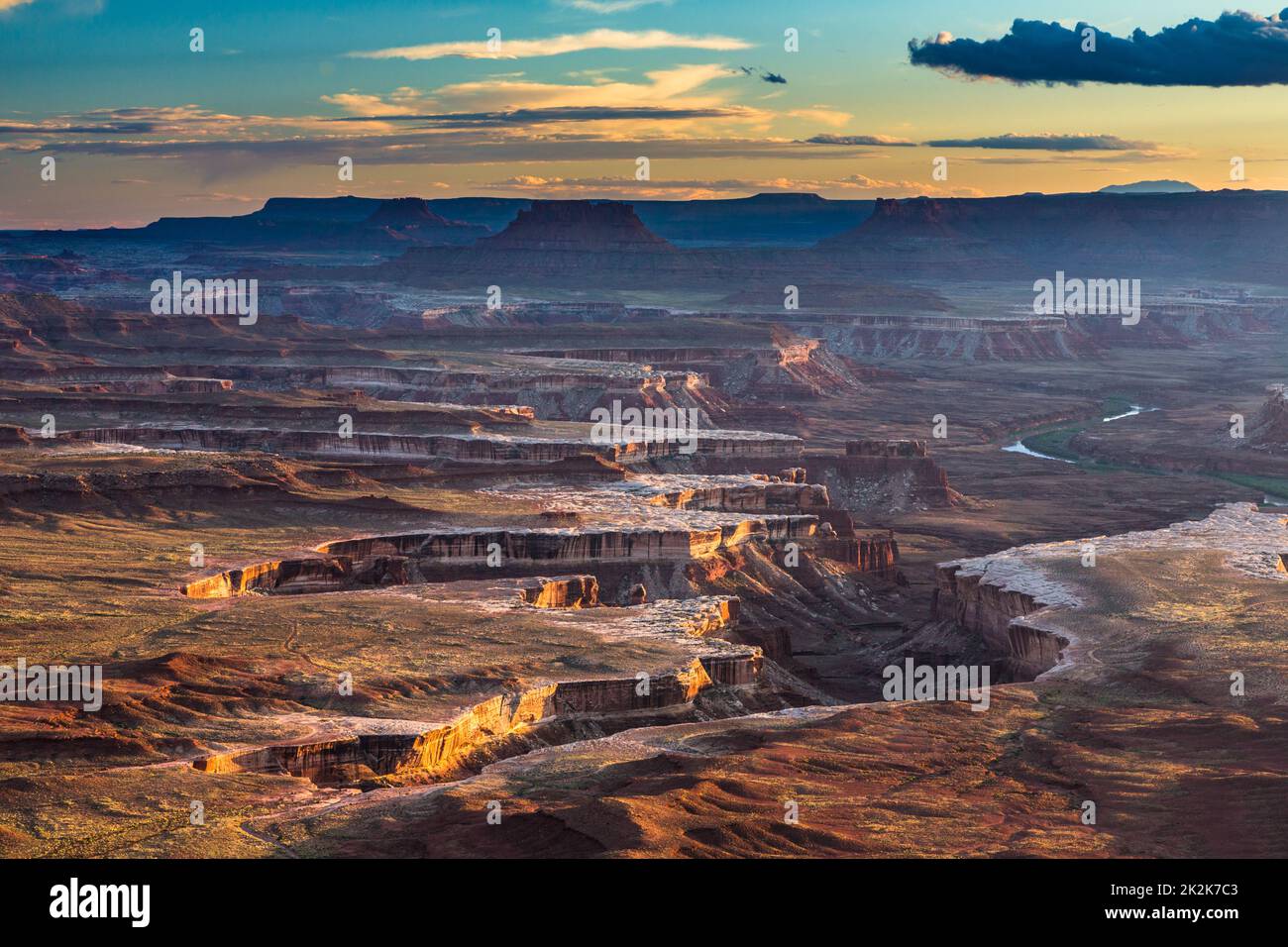Sunset light on the White Rim sandstone cliffs in the Green River Basin ...