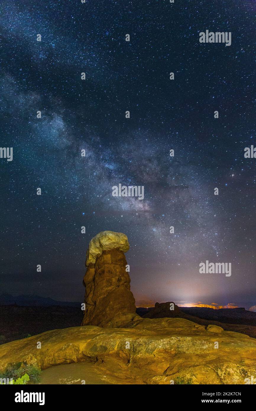 The Milky Way over an Entrada sandstone rock spire at night in Arches ...