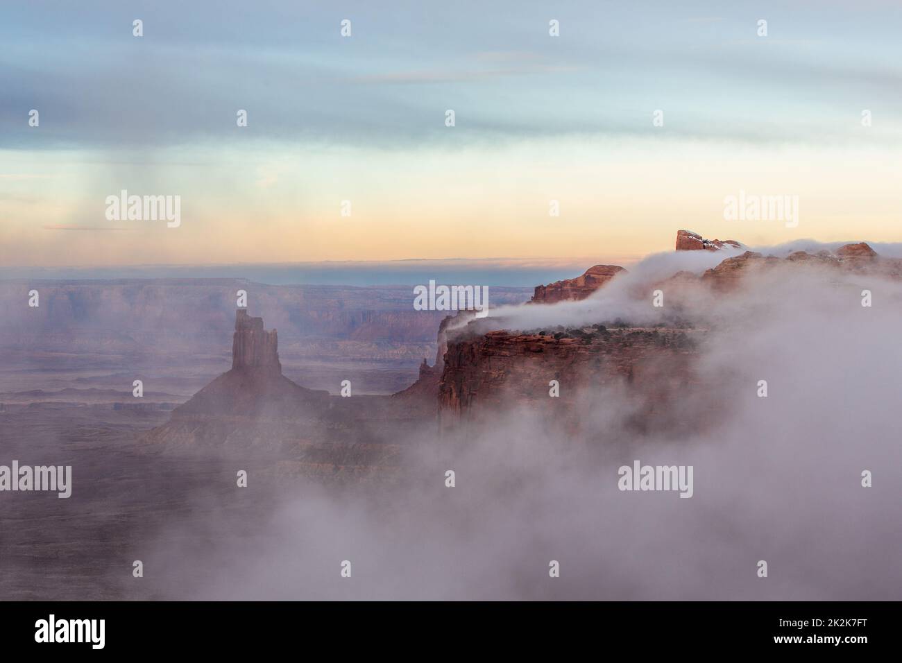 Low clouds flow off the mesa around the Candlestick Tower during a ...