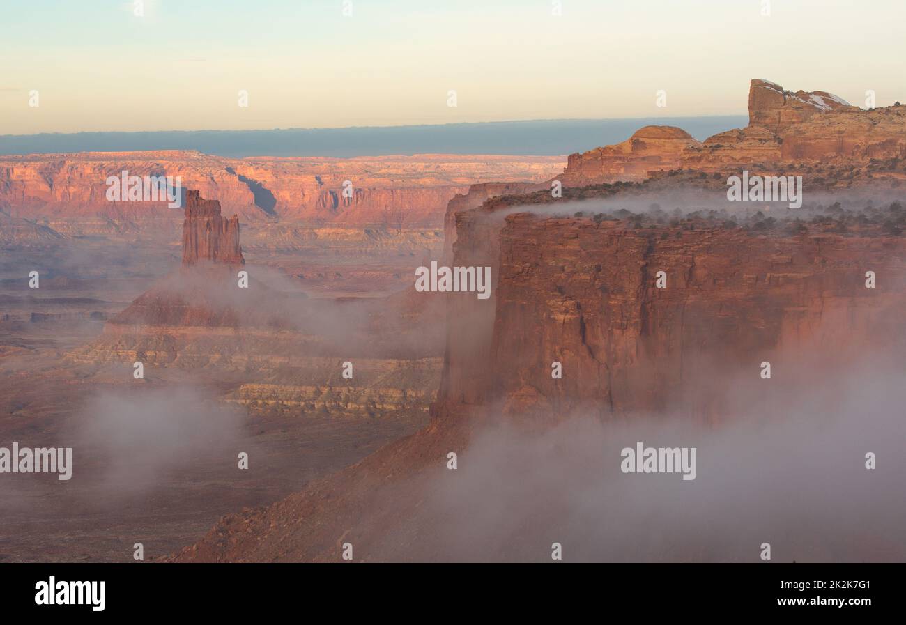Low clouds flow off the mesa around the Candlestick Tower during a ...