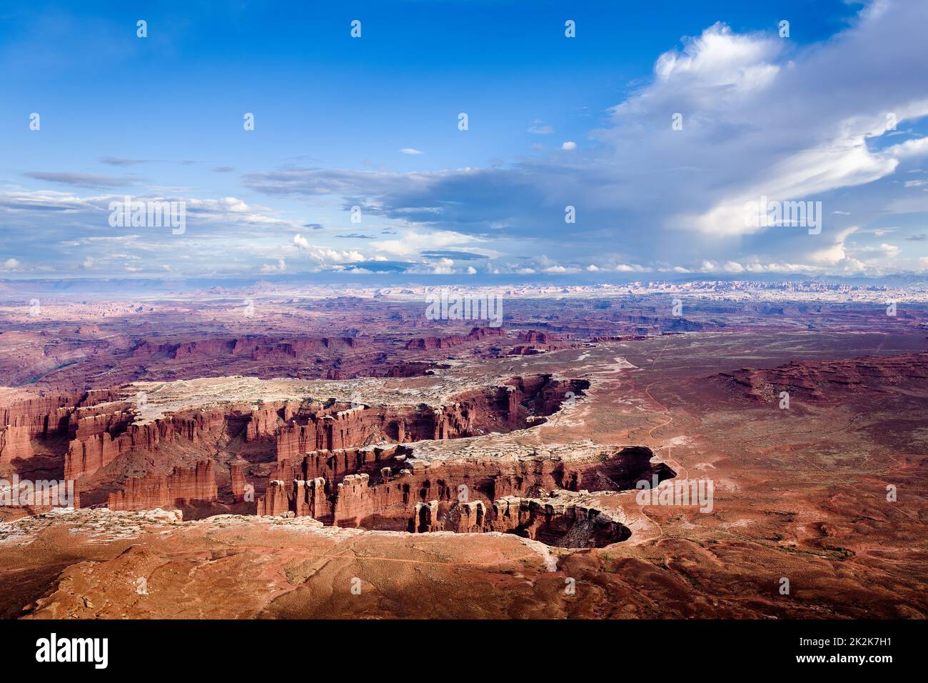 Monument Basin with storm clouds building over the Needles District of ...