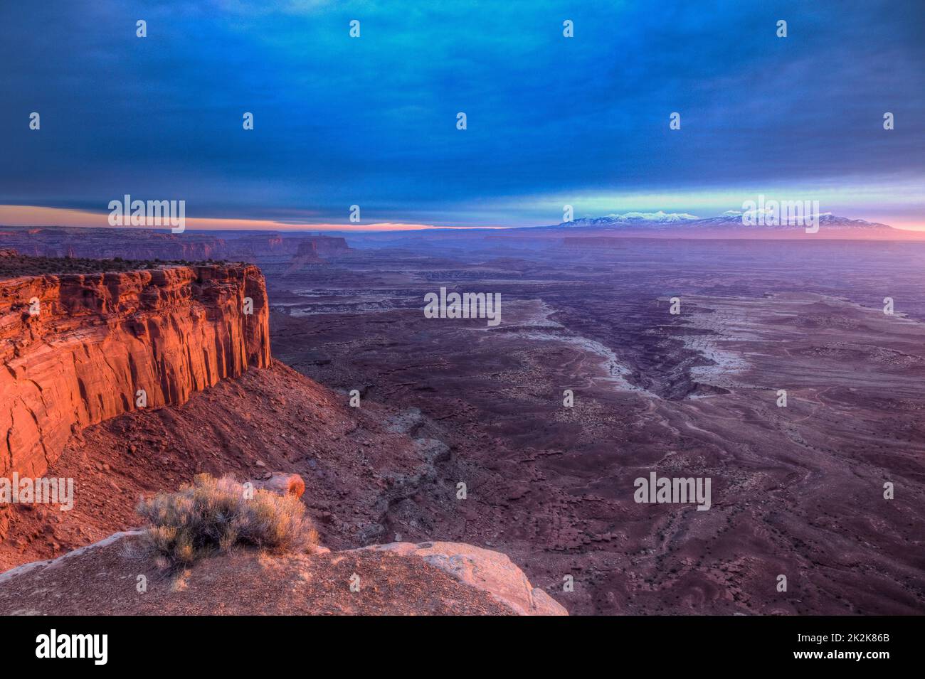 Cloudy sunrise over Buck Canyon, the White Rim & the La Sal Mountains ...