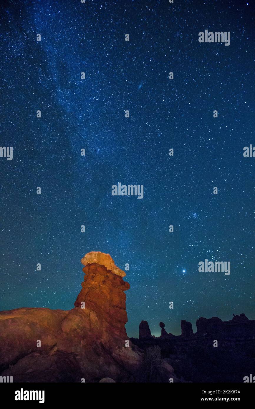 The Milky Way over a sandstone spire in Arches National Park, Moab ...