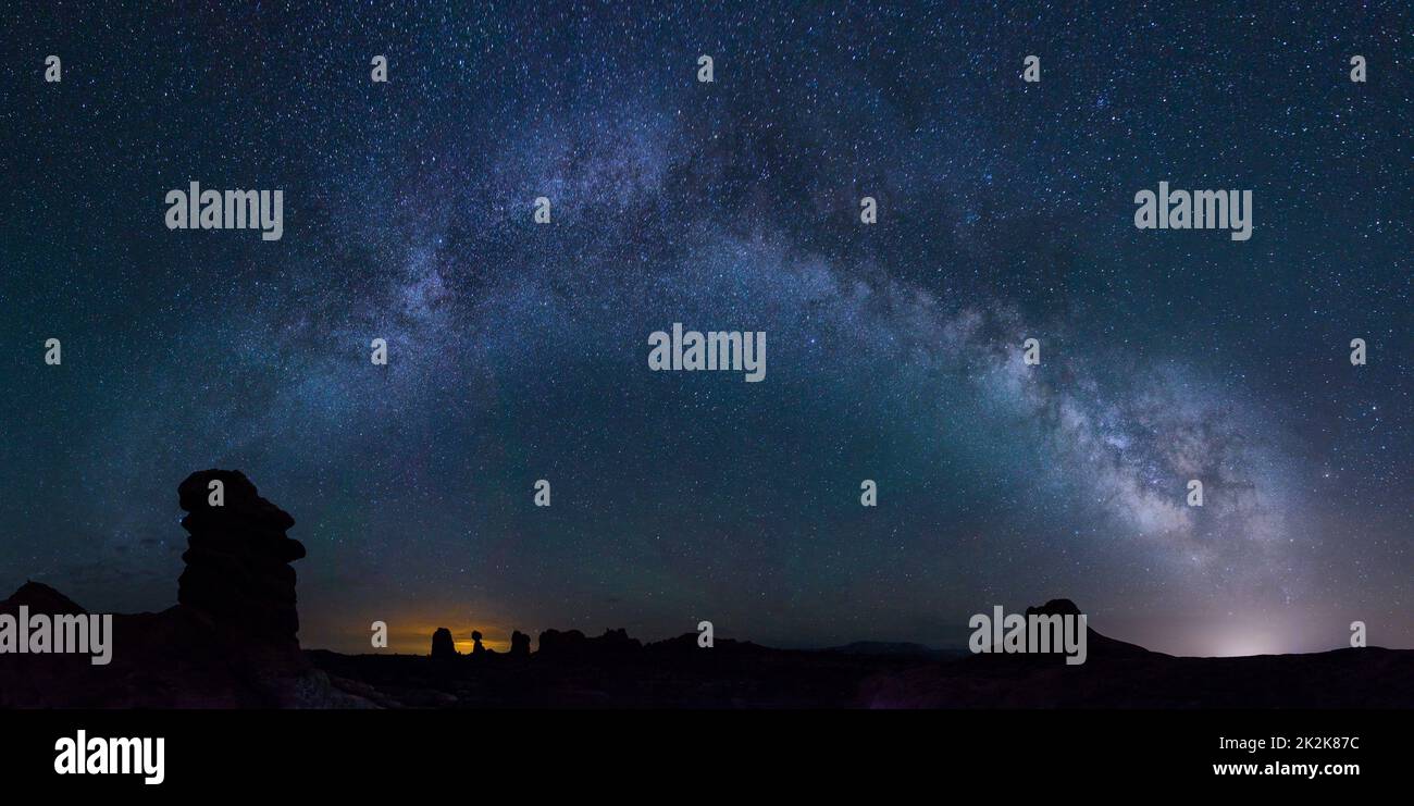 Panoramic arch of the Milky Way over Arches Natioinal Park with ...