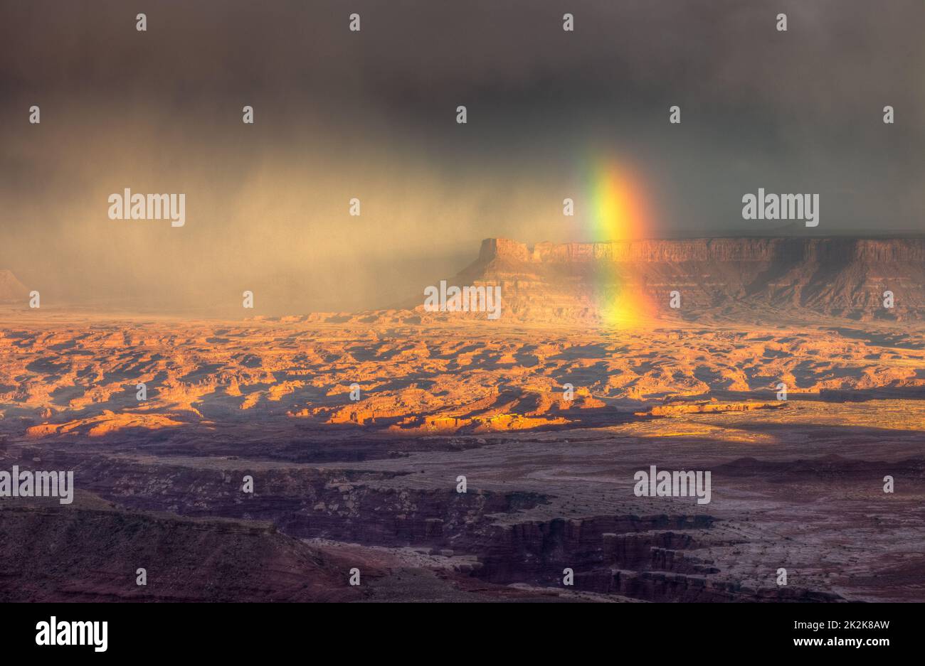 Storm with a rainbow over Canyonlands National Park, Moab, Utah. View ...