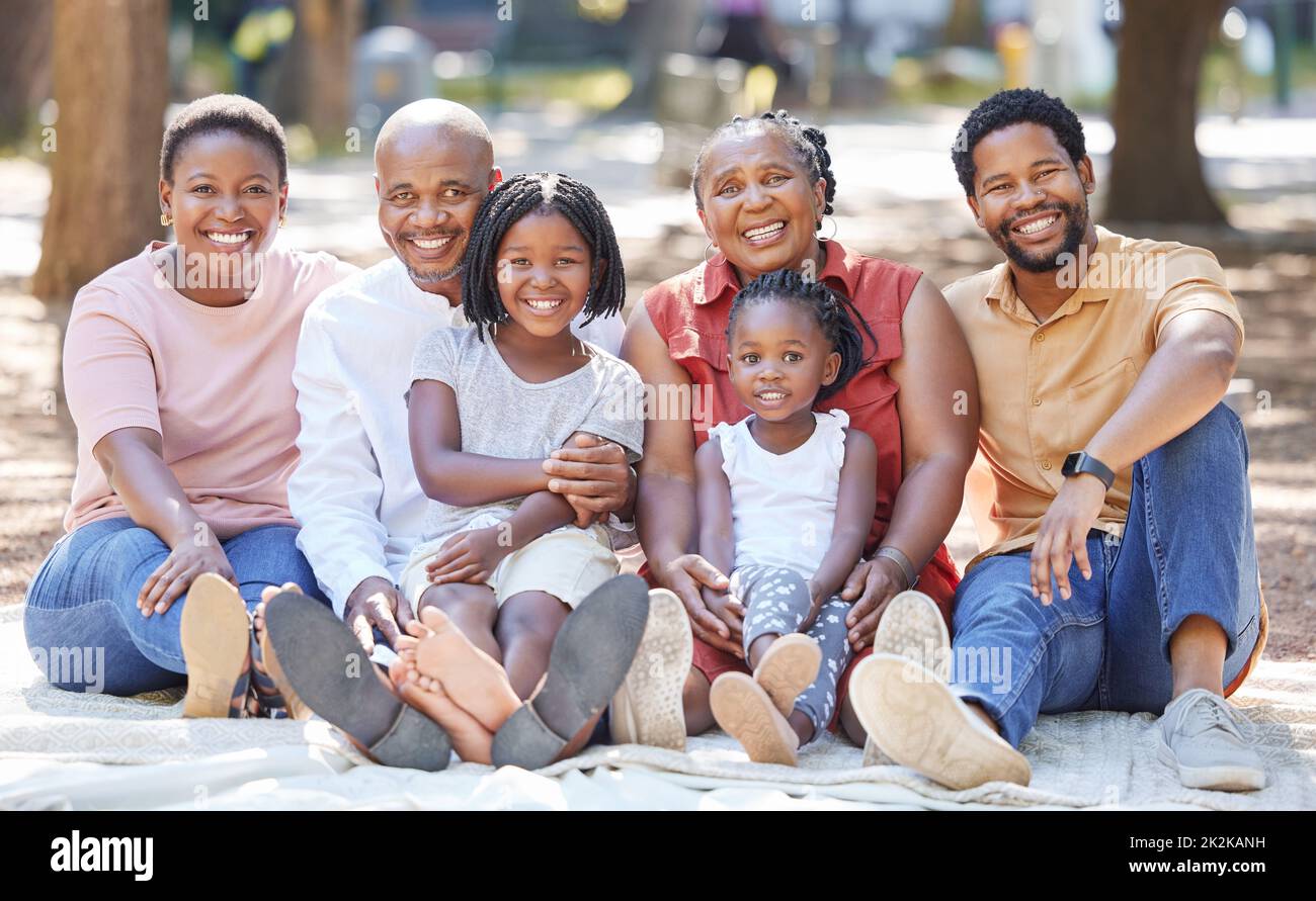 Love, smile and black family bonding outdoors, relax and happy, having ...