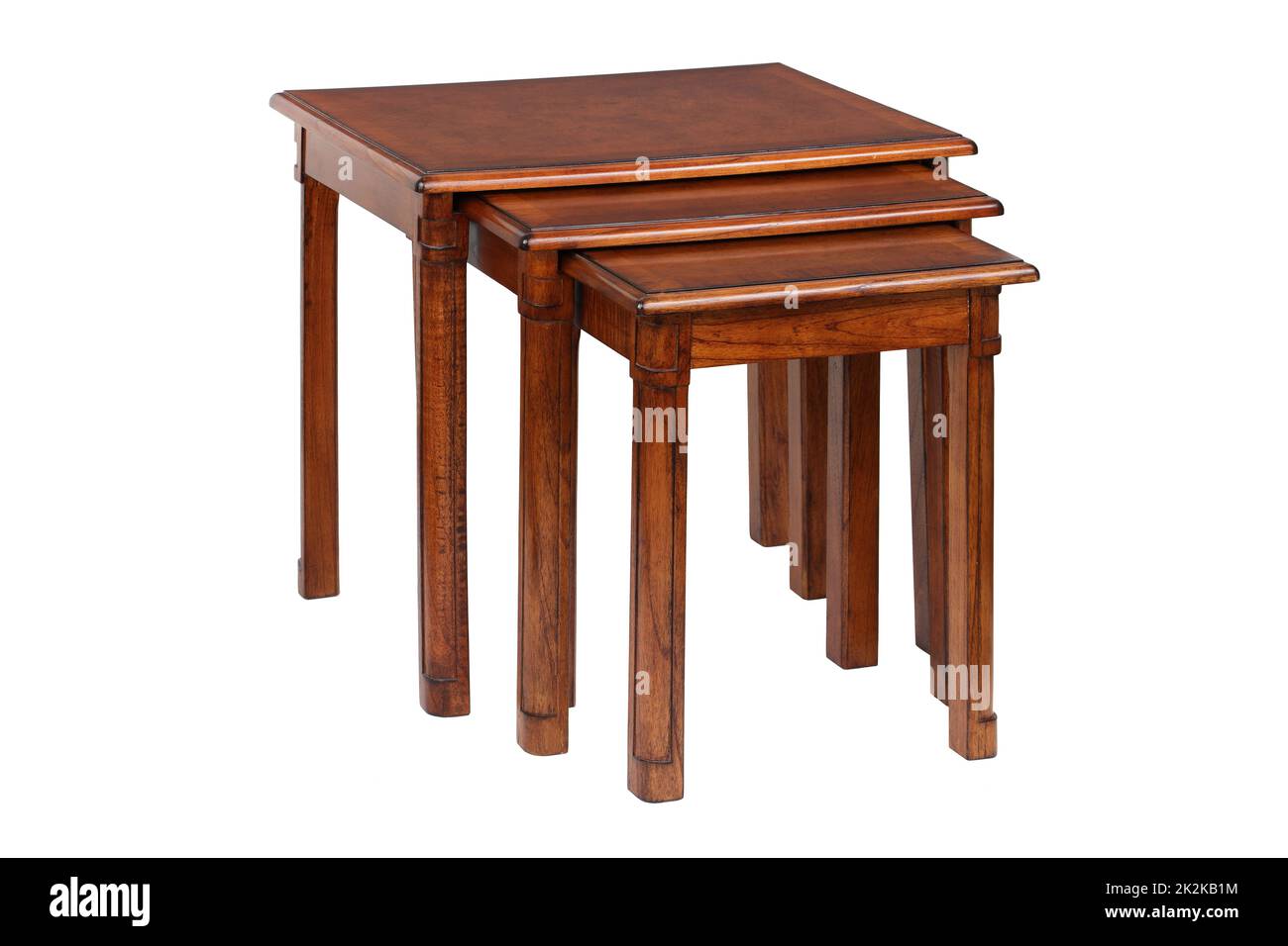 Nest of three old retro wood tables isolated on white with clipping ...