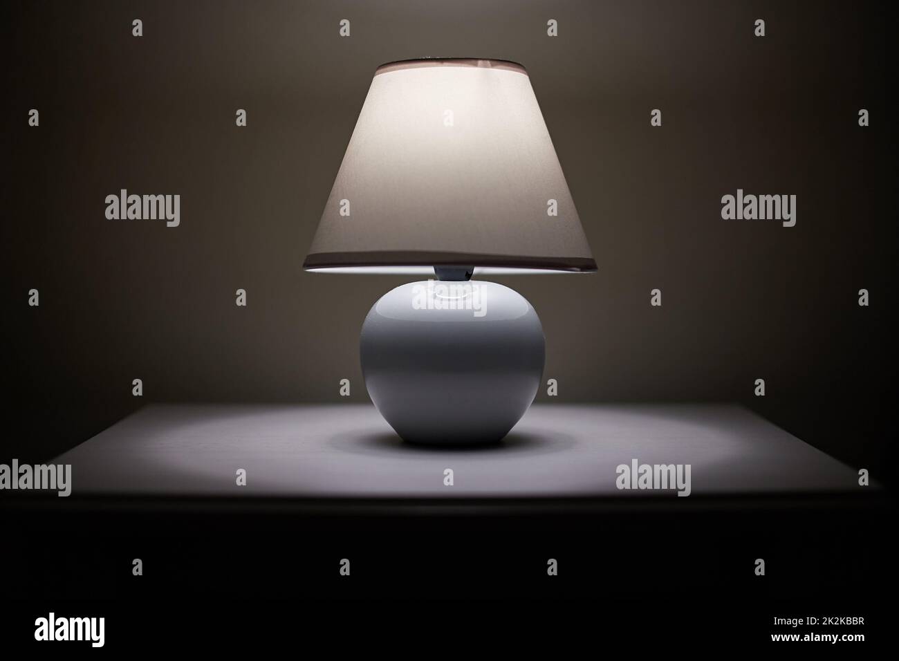 Lamp on a nightstand Stock Photo - Alamy