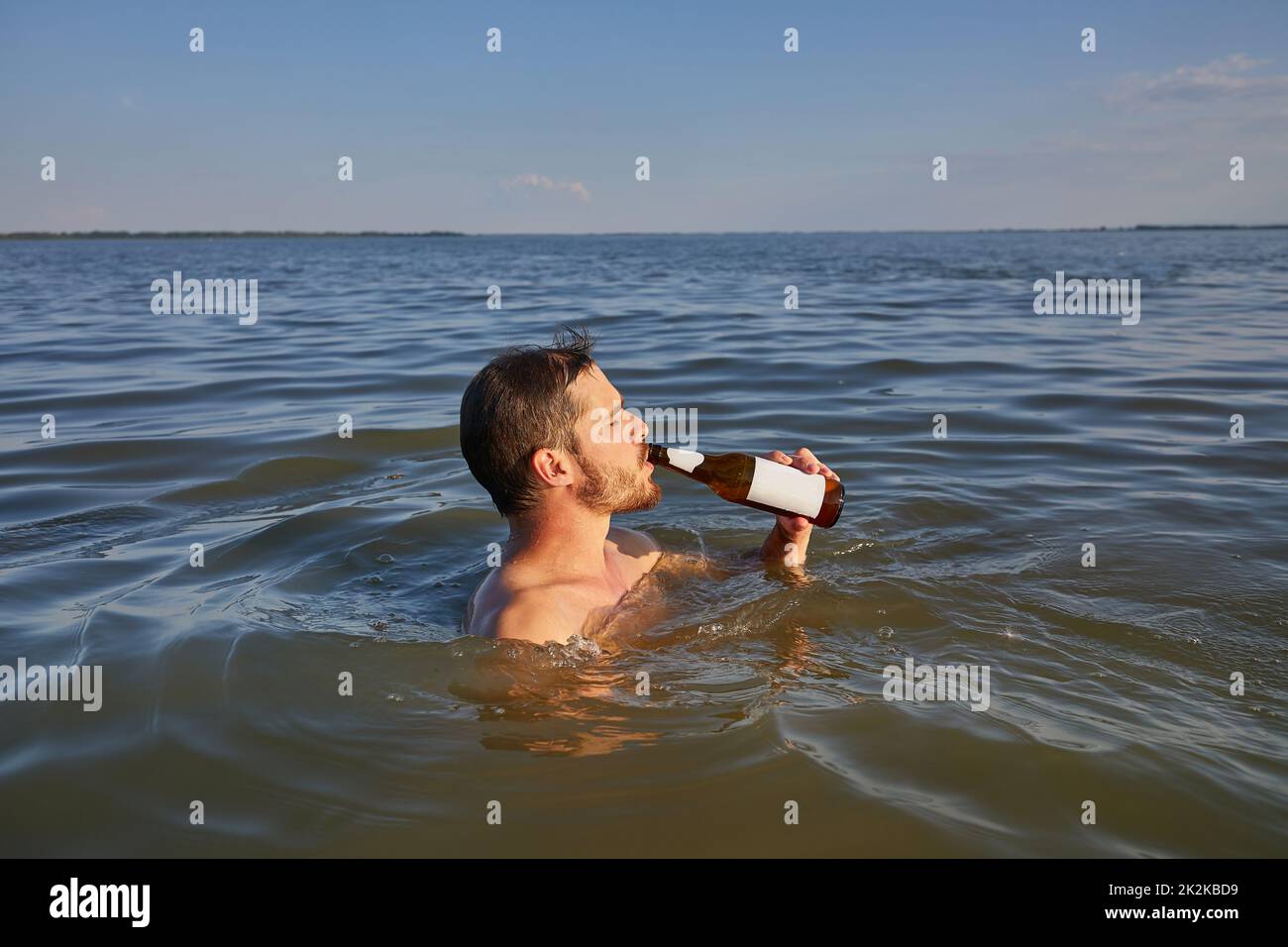 Man swimming sunset hi-res stock photography and images - Alamy