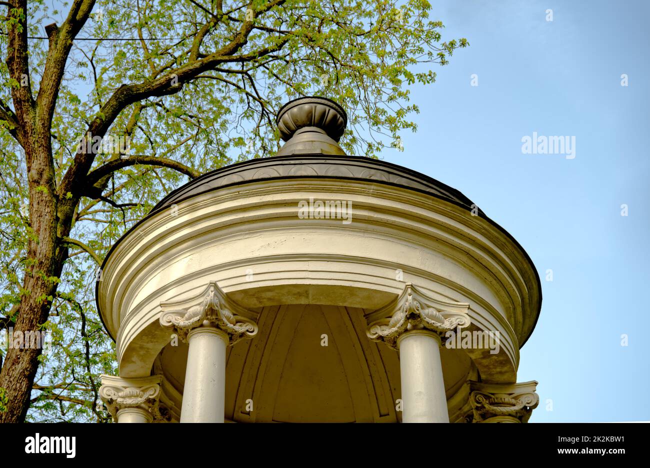 rococo architecture, roof of a little white temple next to a tree ...