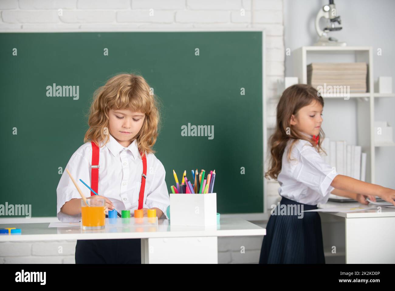 Portrait school kids doing art homework. Children drawing on elementary ...