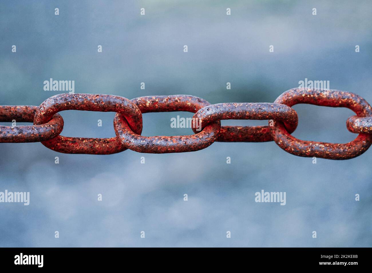 fence with an old rusty chain Stock Photo - Alamy