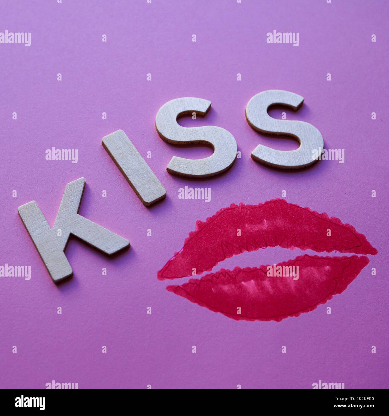 lips and kiss word with wooden letters on the pink background Stock ...